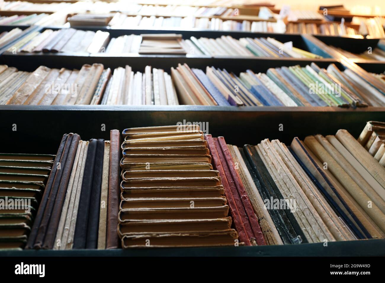 Many books on bookshelf in library Stock Photo - Alamy
