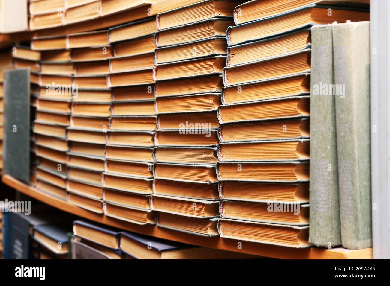 Many books on bookshelf in library Stock Photo - Alamy