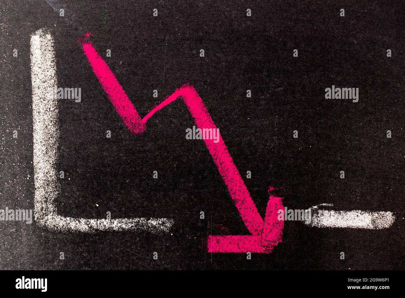 Red chalk drawing in down trend arrow break the graph line shape on ...