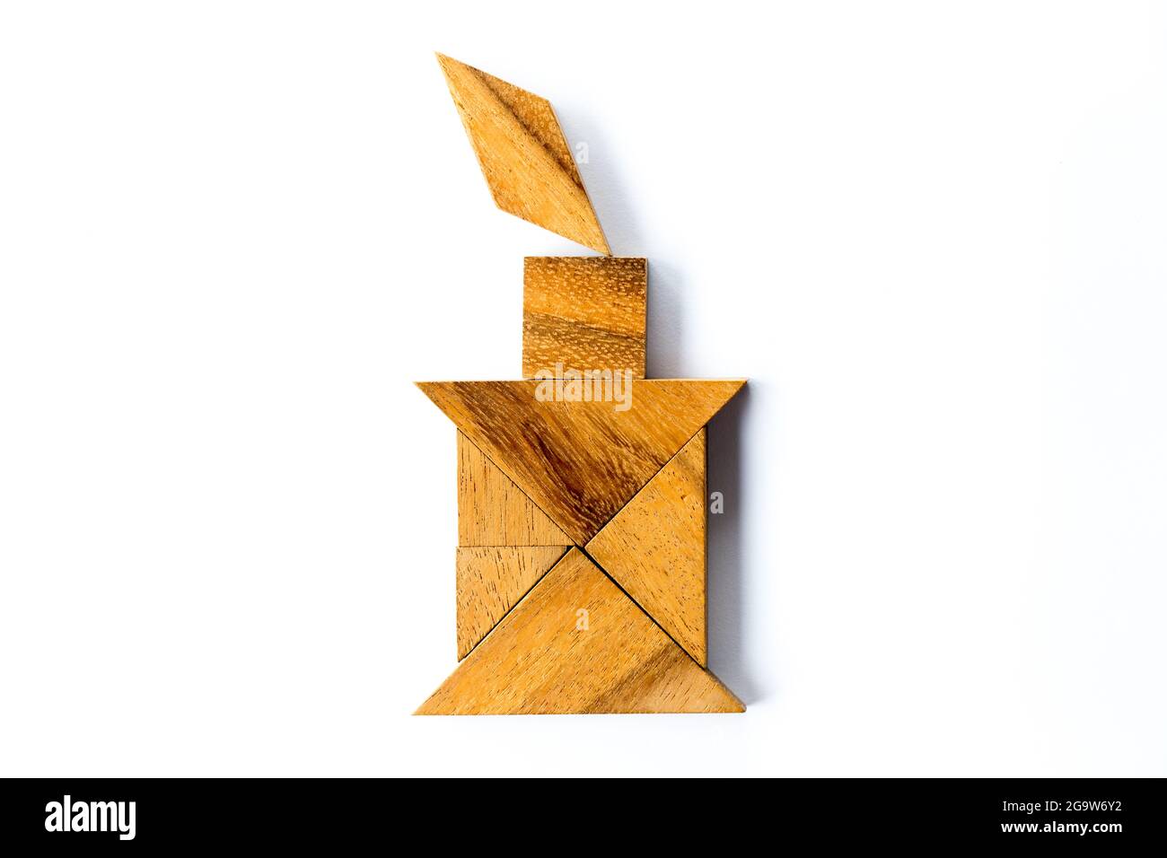 Wood tangram puzzle in candle shape on white background Stock Photo - Alamy