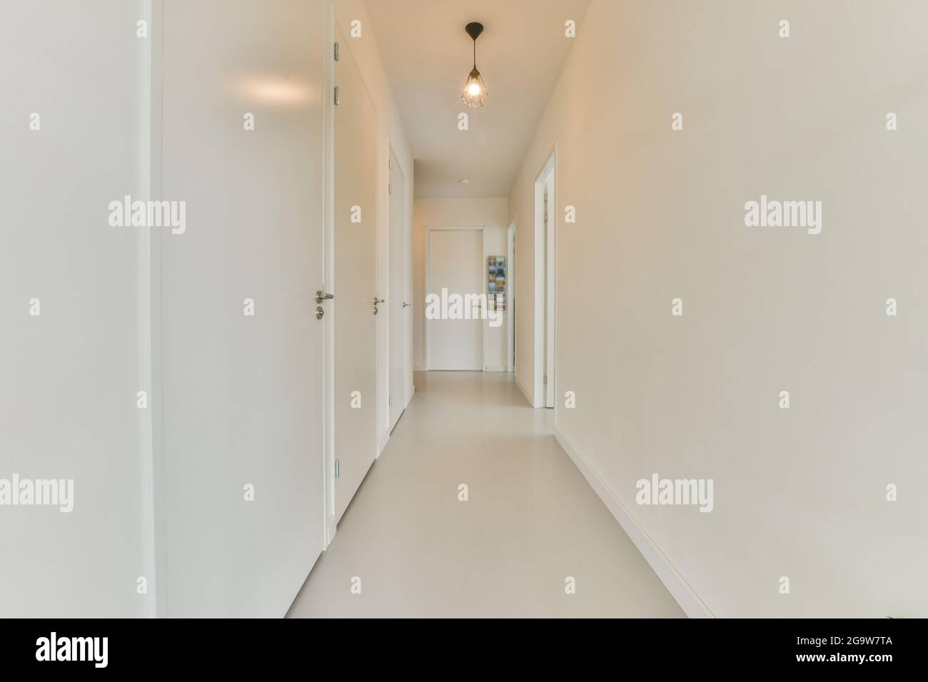 A long empty corridor designed in minimalistic style Stock Photo - Alamy