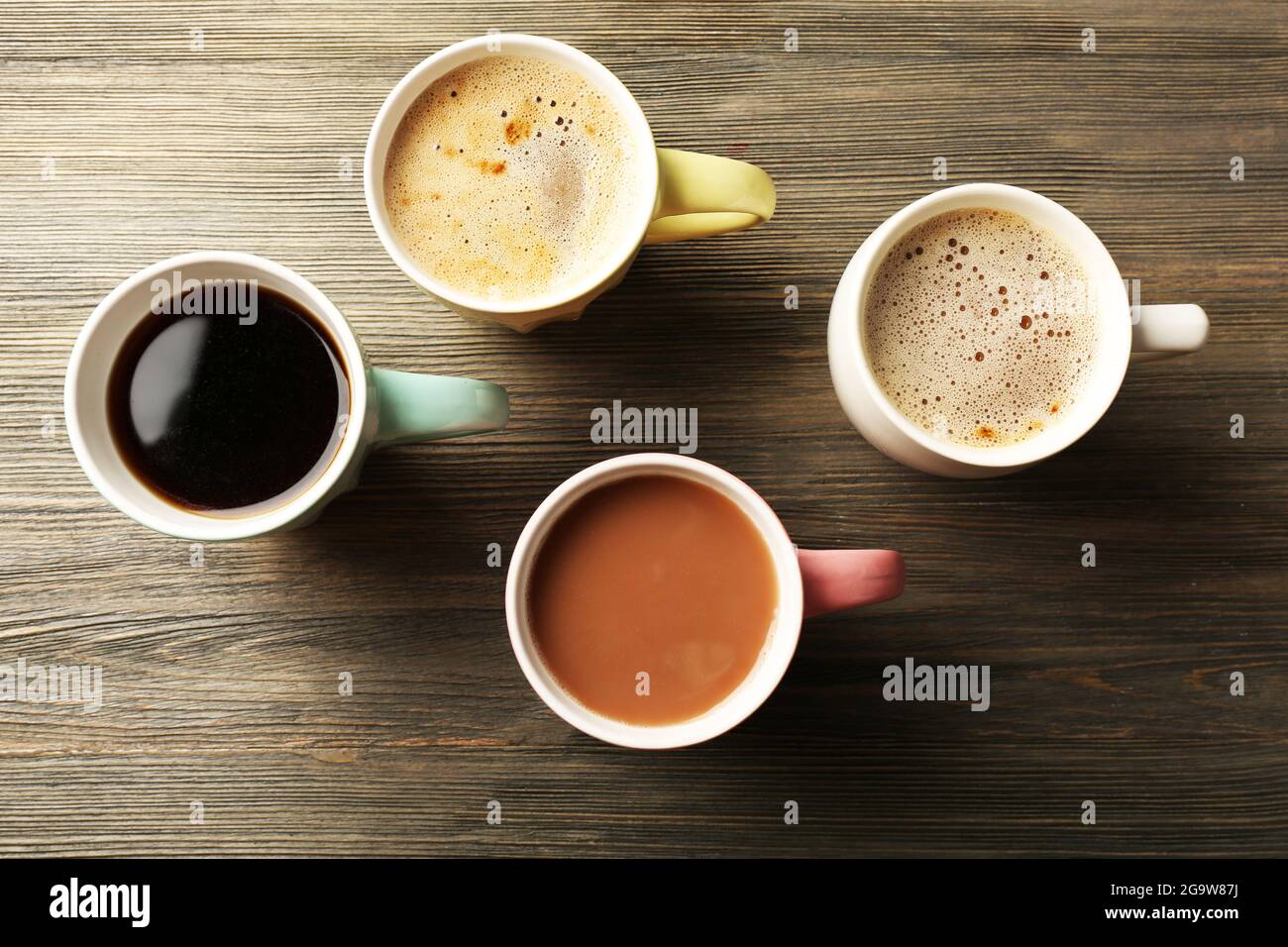 Many cups of coffee on wooden table background Stock Photo - Alamy