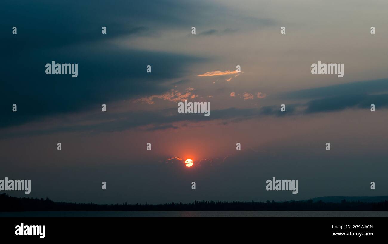 Sunset through smoke filled skies Stock Photo - Alamy