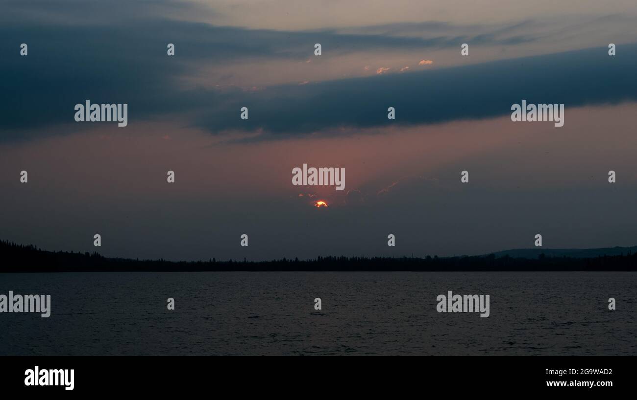 Sunset through smoke filled skies Stock Photo - Alamy