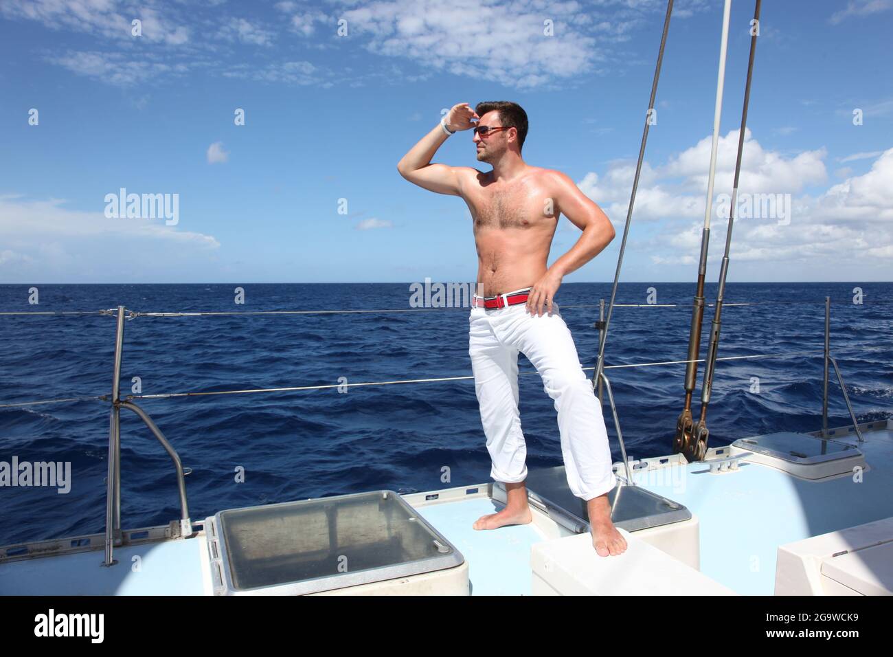 Happy man enjoying sailing boat hi-res stock photography and images - Alamy