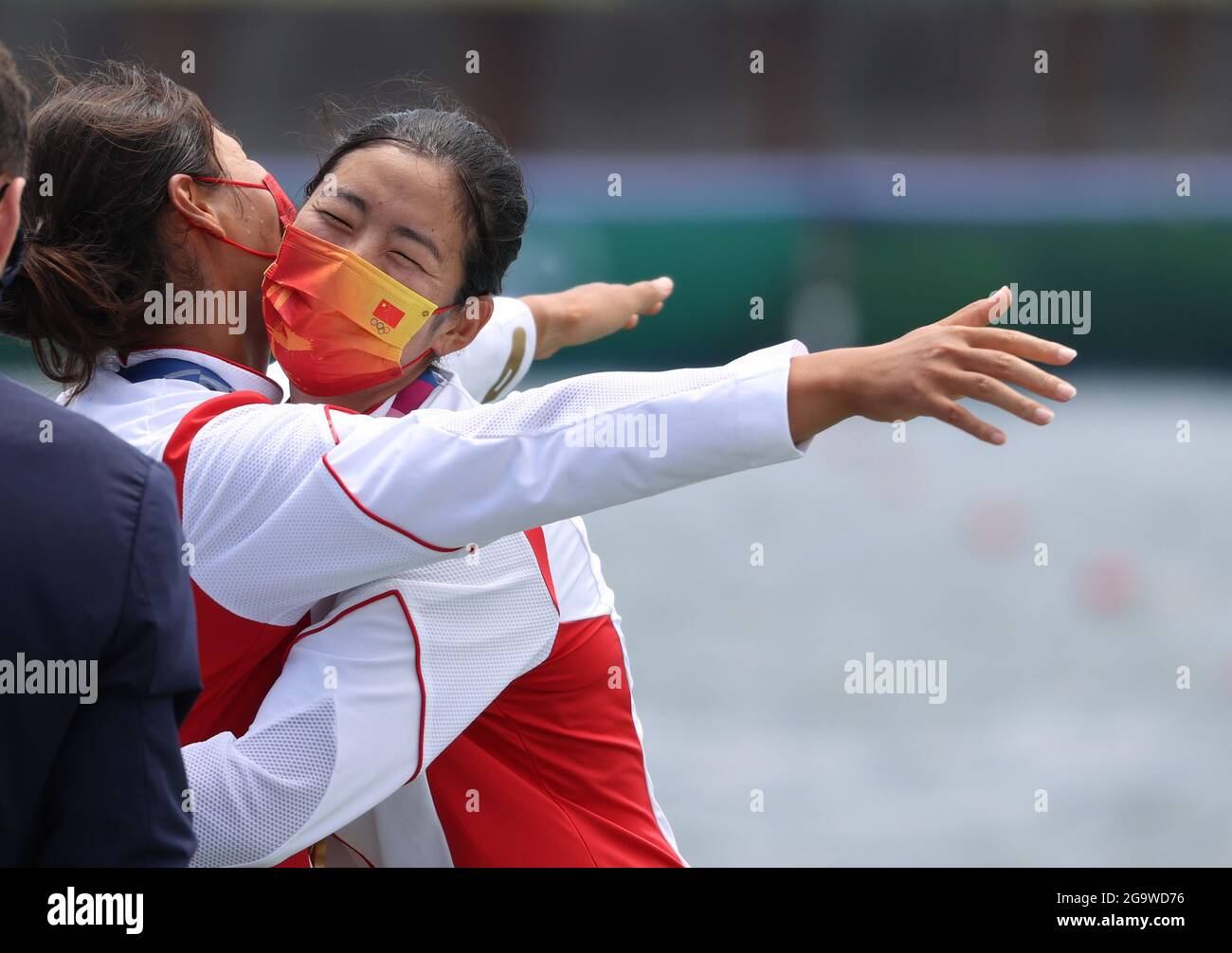 Tokyo, Japan. 28th July, 2021. Chinese rower Cui Xiaotong (R) reacts ...