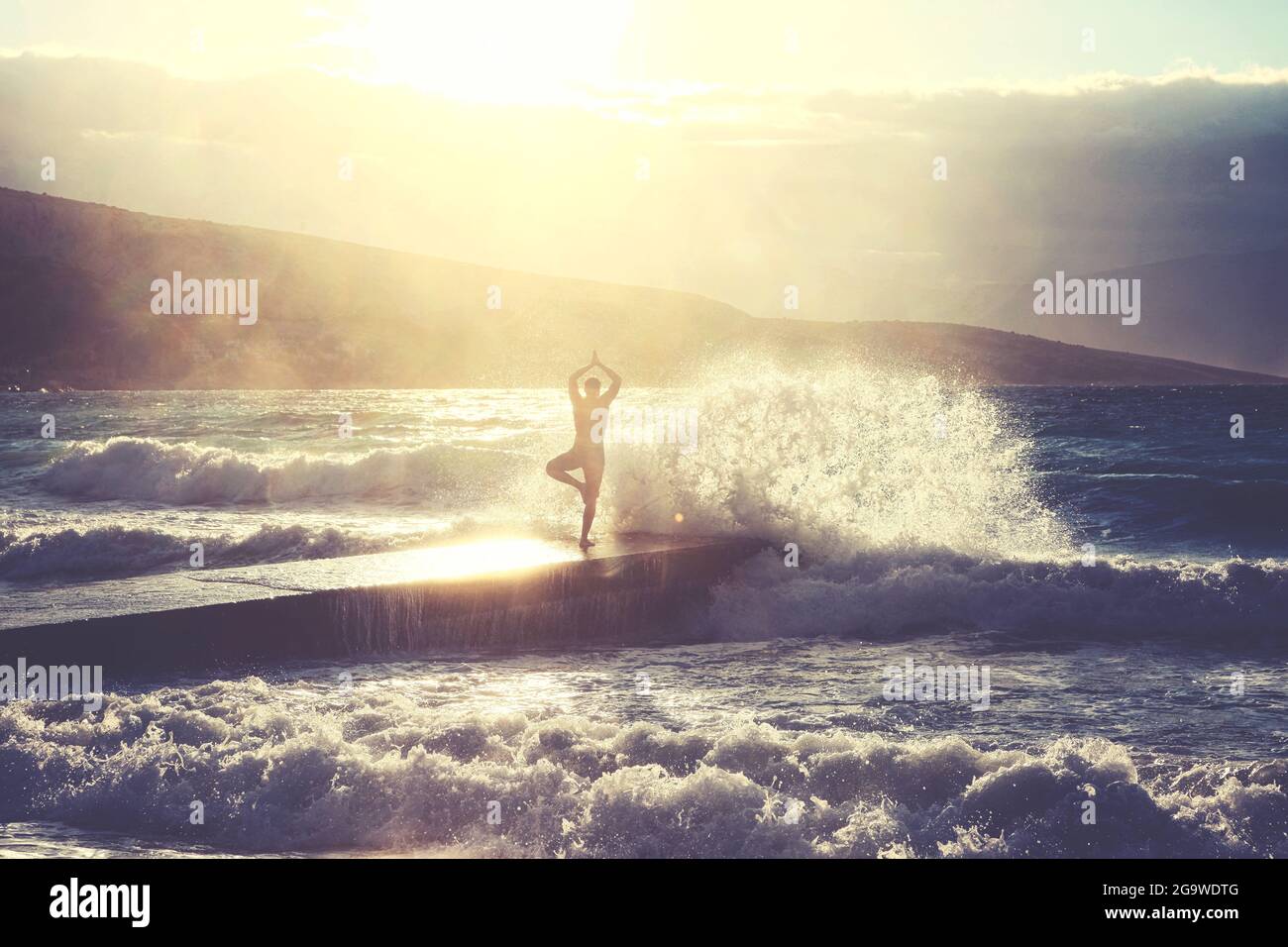 Feeling of freedom concept. Man standing on pier facing to the sea with ...