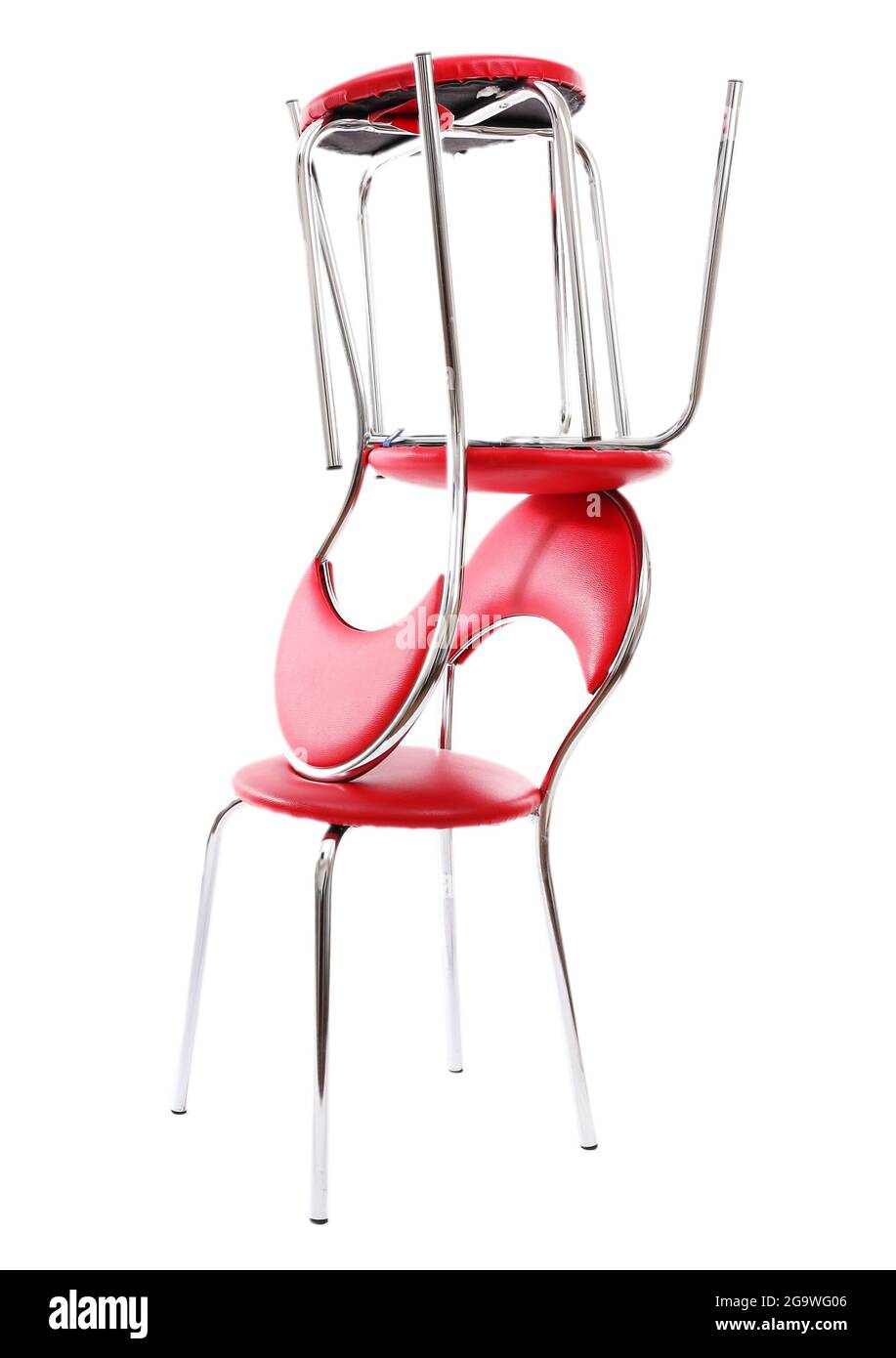 Stack of red chairs isolated on white Stock Photo - Alamy