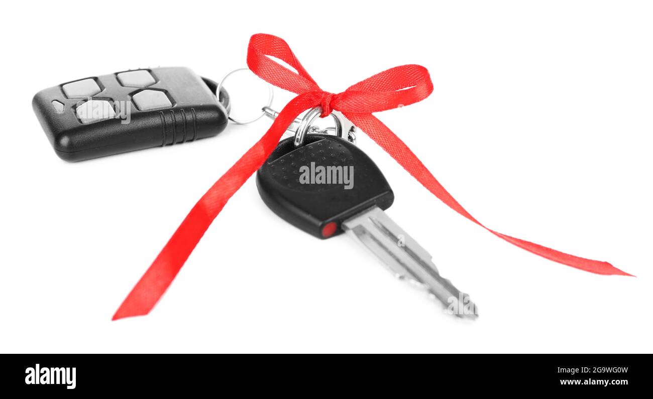 Car keys with red bow as present isolated on white Stock Photo - Alamy
