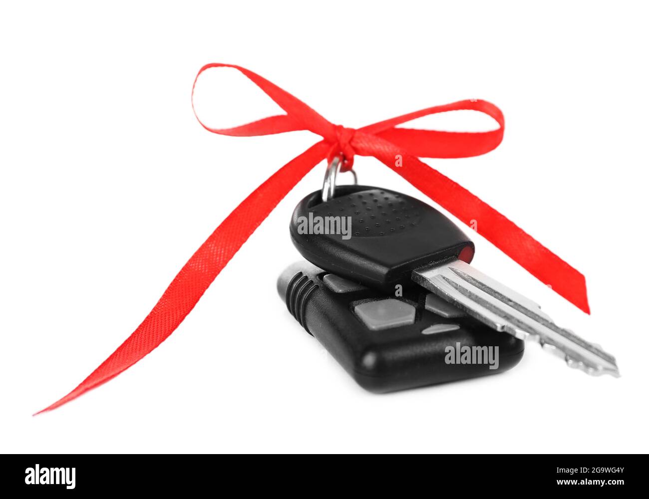 Car keys with red bow as present isolated on white Stock Photo - Alamy