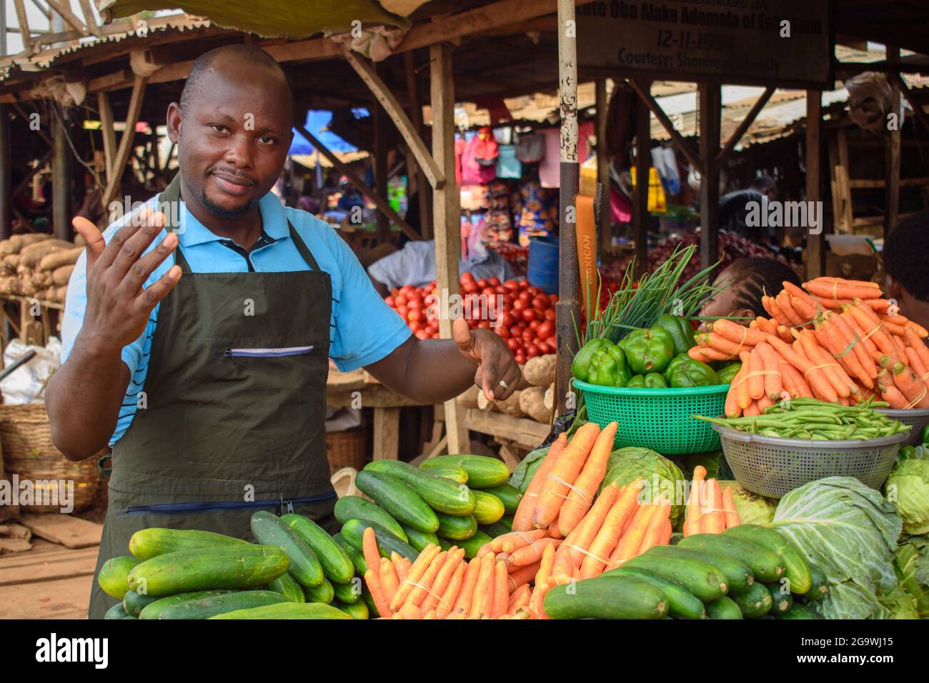 stock photo of male African grocery seller or business man with apron ...