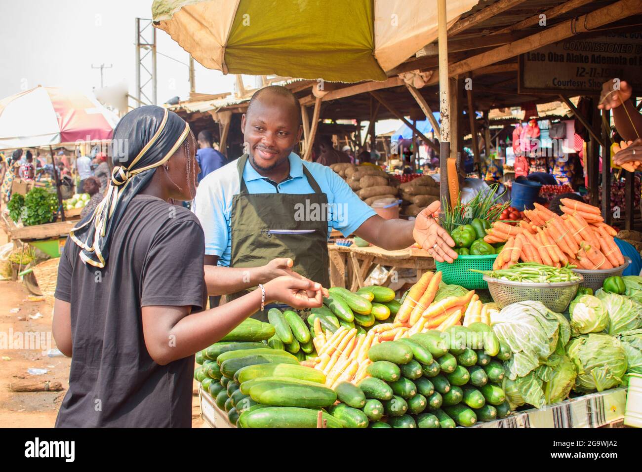 stock photo of male African grocery seller or business man with apron ...