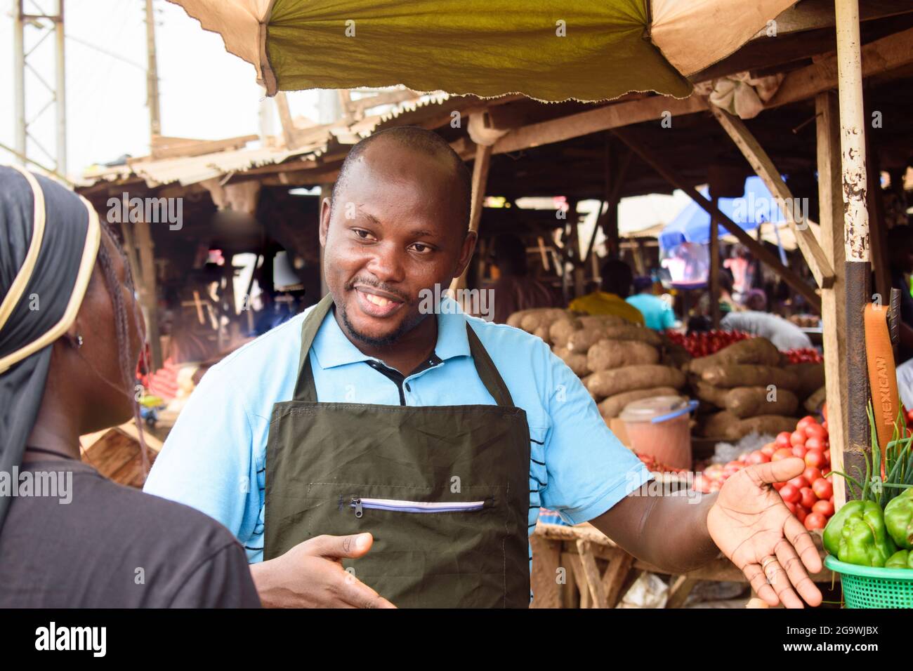 stock photo of male African grocery seller or business man with apron ...