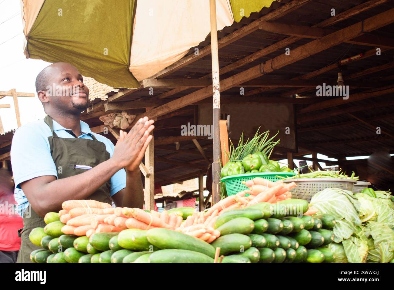 stock photo of male African grocery seller or business man with apron ...