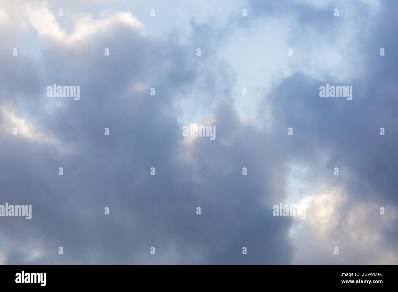 Simple beautiful gloomy blue sky with fluffy clouds on peaceful summer ...
