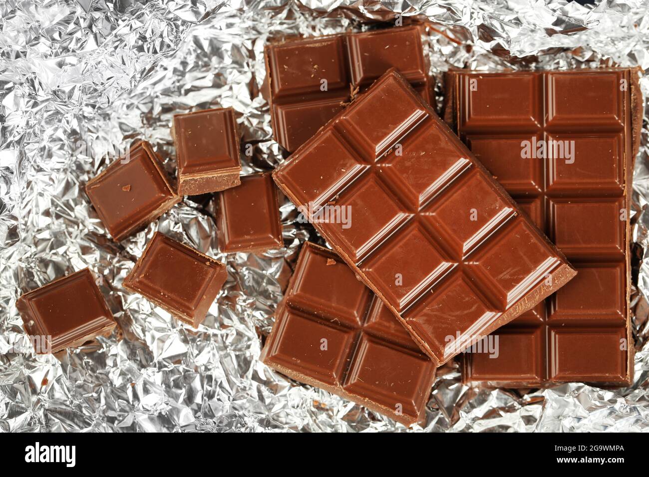 Chocolate on foil, closeup Stock Photo - Alamy