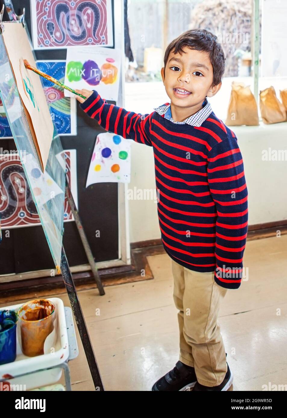 Young happy male artist painting hi-res stock photography and images ...