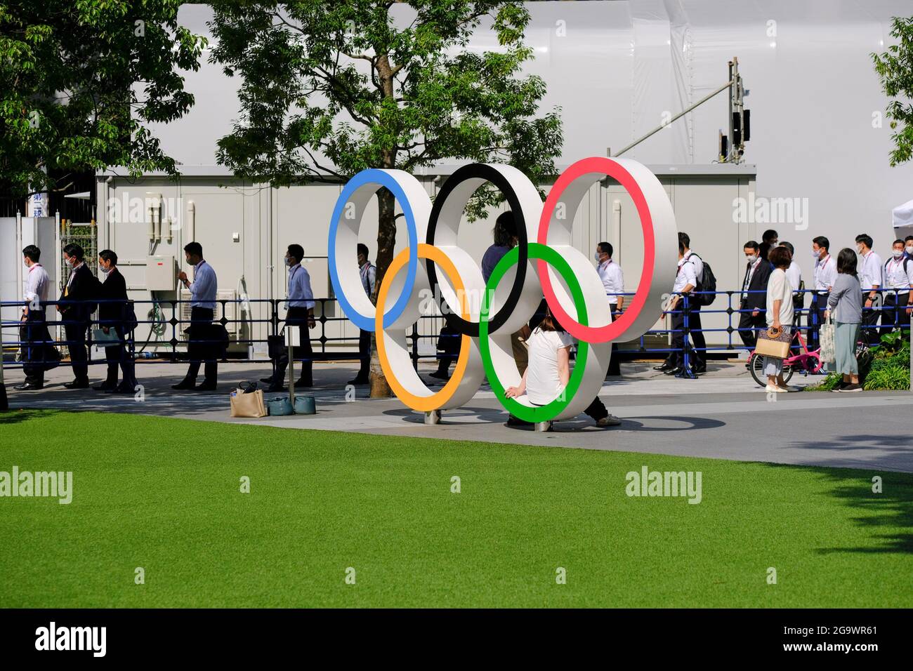 Tokyo, Japan. 15th July, 2021. People wearing face masks walk near the ...