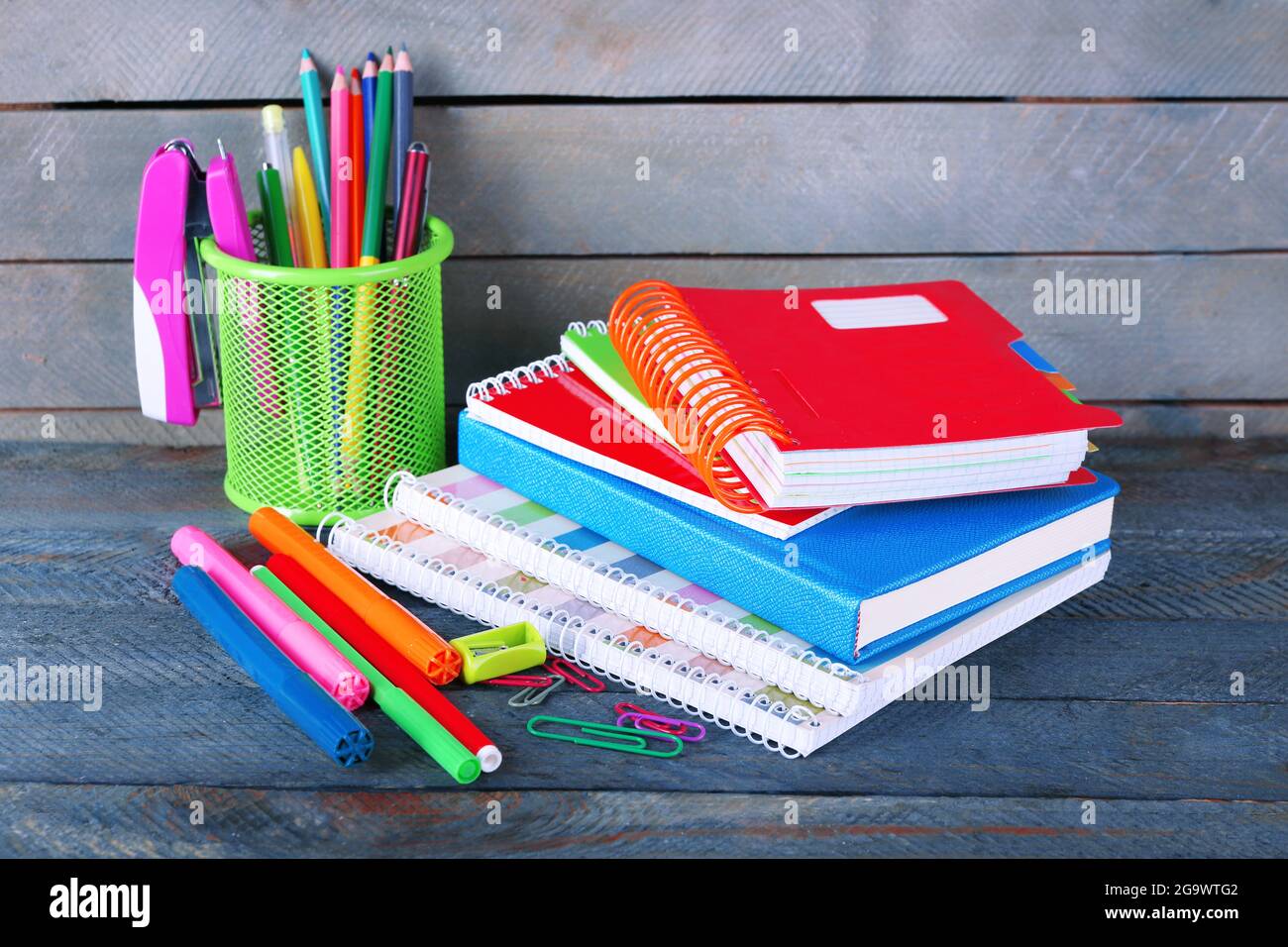 Colorful stationery on wooden background Stock Photo - Alamy