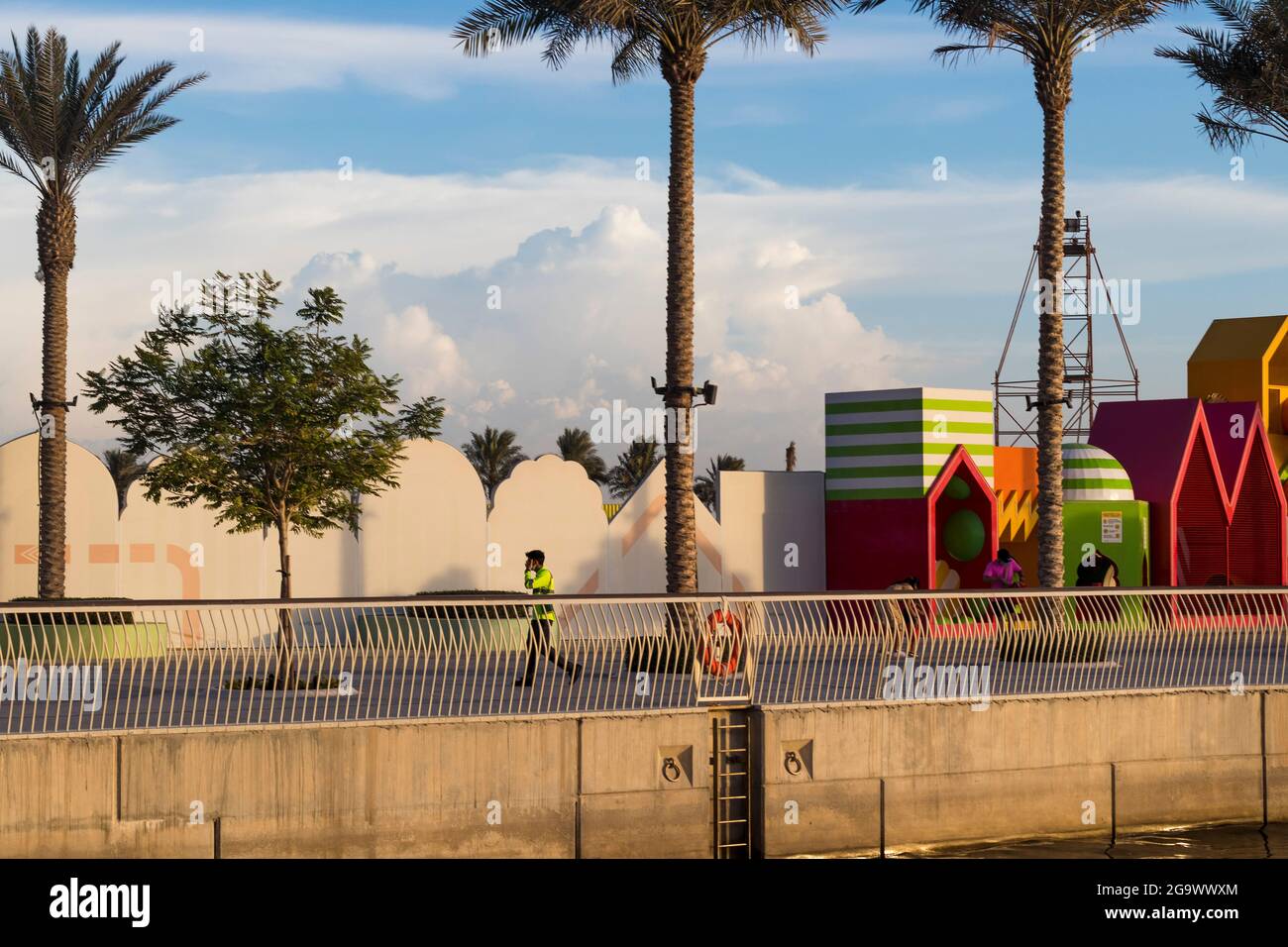 Dubai, UAE - 07.17.2021 Security guard walking at Dubai creek harbor ...