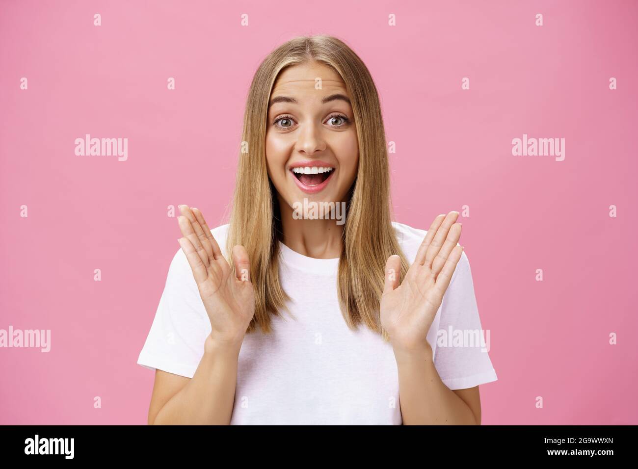 Woman learning awesome great news clasping hands in joy and excitement ...