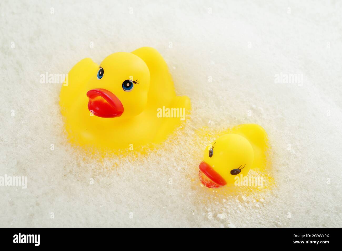 Rubber ducks in foam close-up Stock Photo - Alamy