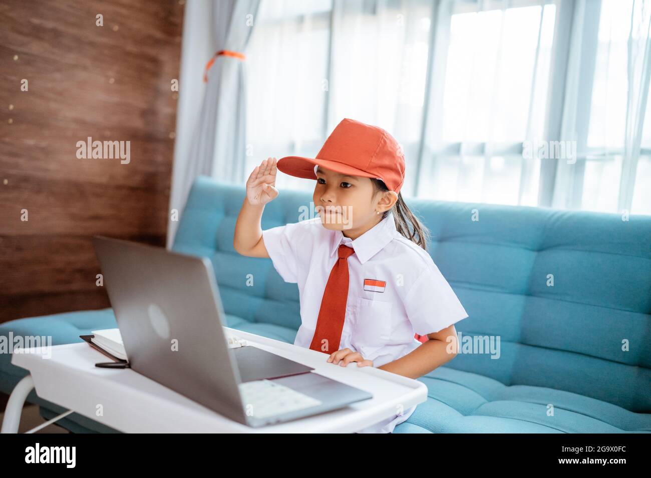 asian primary school student with uniform giving salute Stock Photo - Alamy