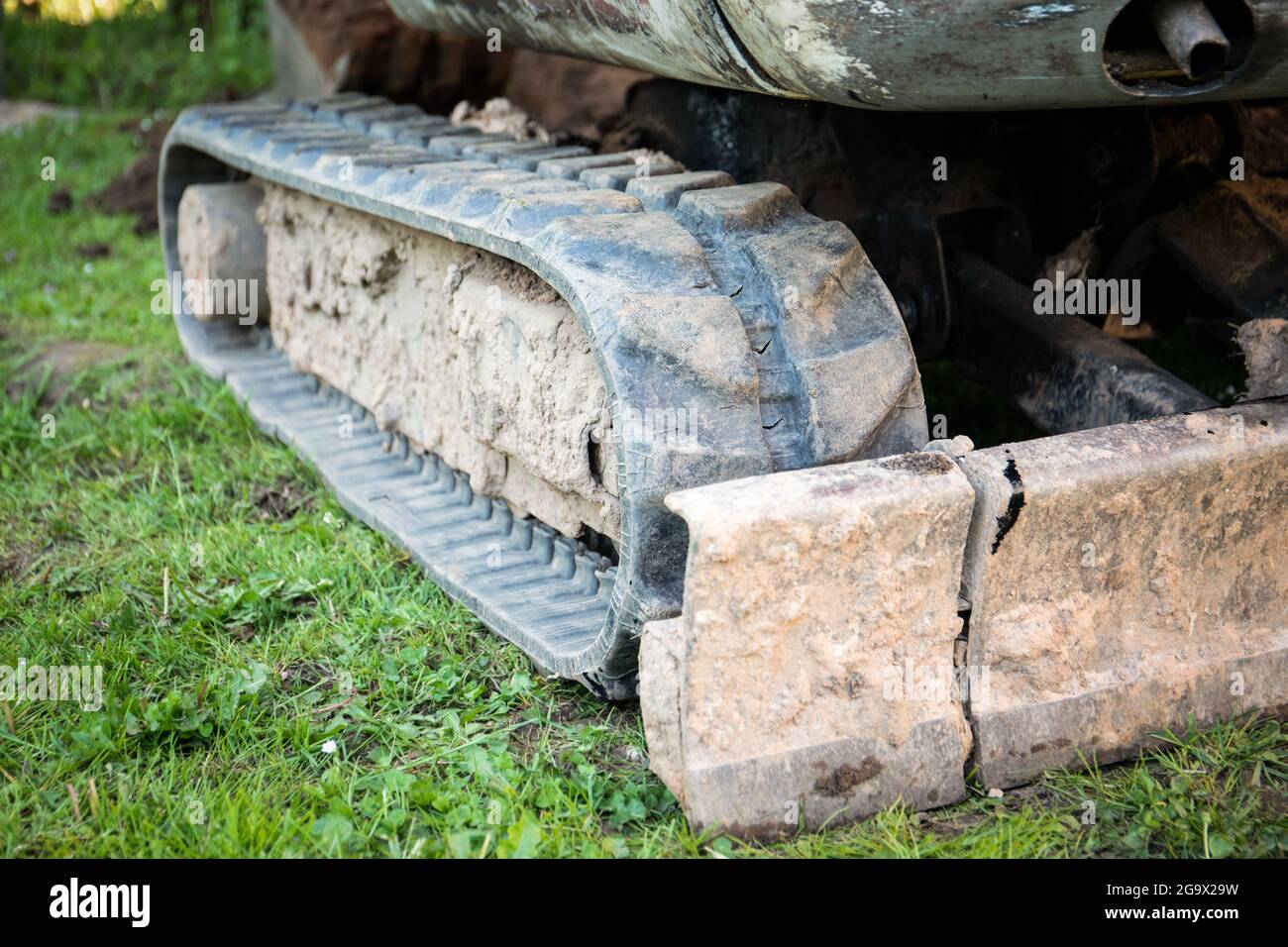 Mini tractor rubber tracks. Construction site and equipment Stock Photo ...