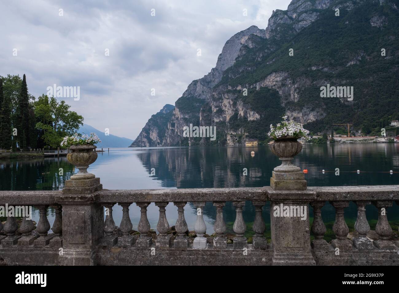 Promenade in Riva del Garda with view on lake and mountain Stock Photo ...