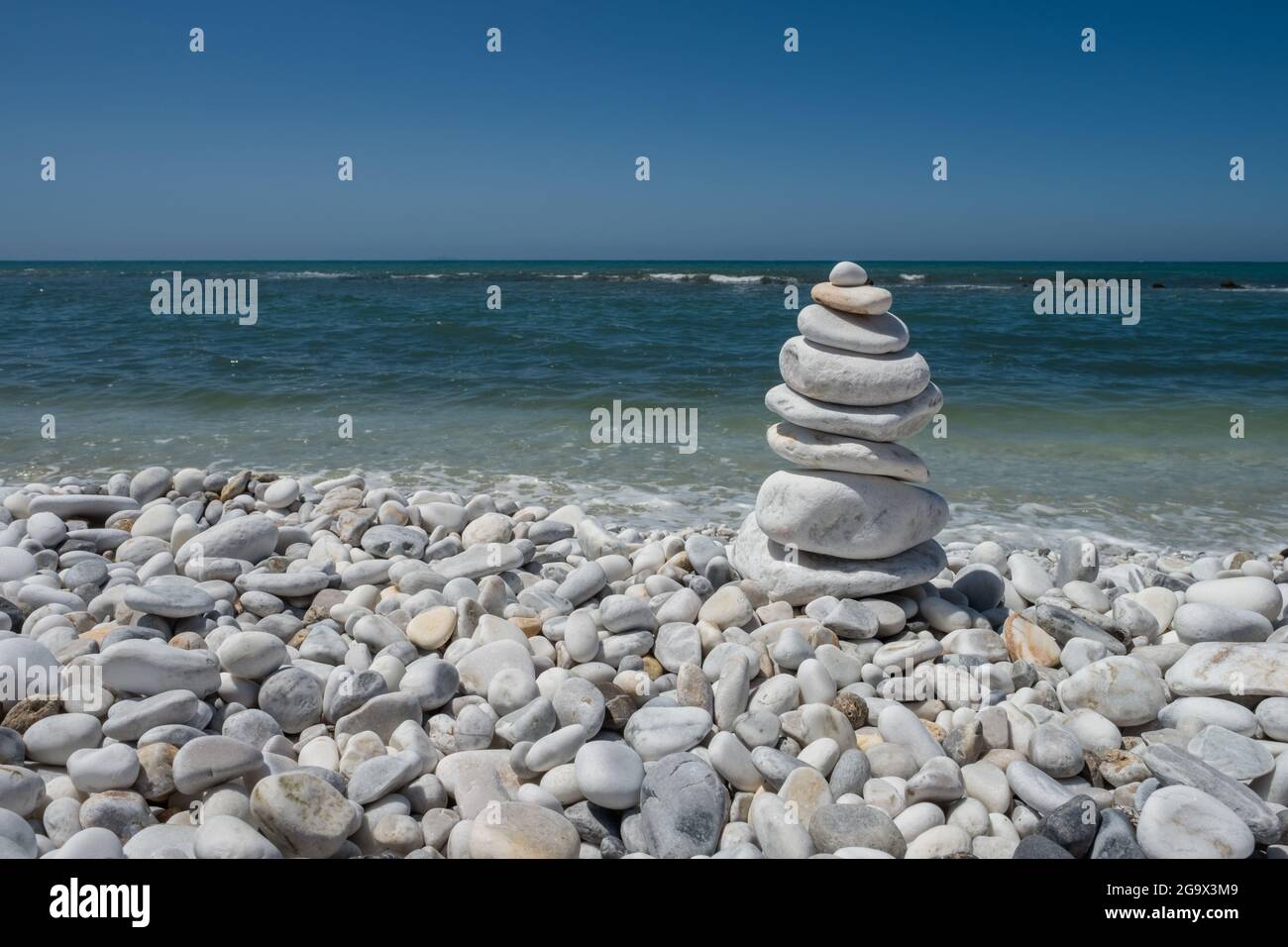 Pile of stones on sea beach Stock Photo - Alamy