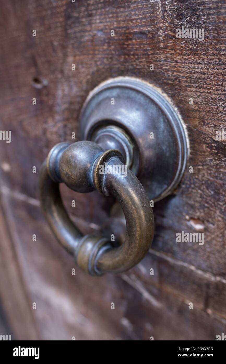Ancient italian door handle close-up Stock Photo - Alamy