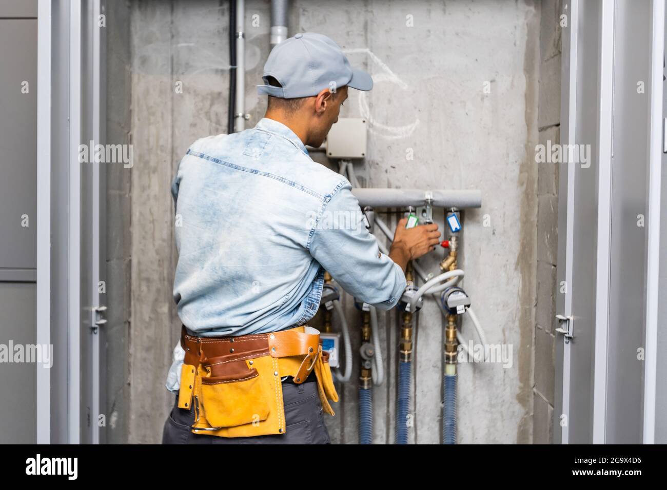 Plumber Repairing Water Pipes In Residential Building Stock Photo - Alamy
