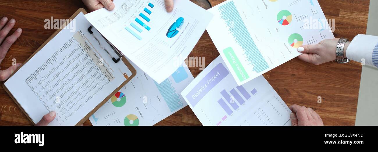 Group of business people discussing charts on paper top view Stock ...