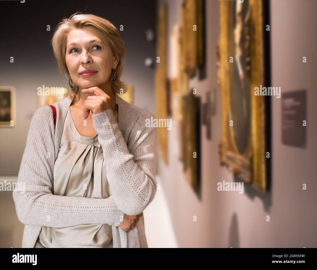 Adult woman in museum Stock Photo - Alamy