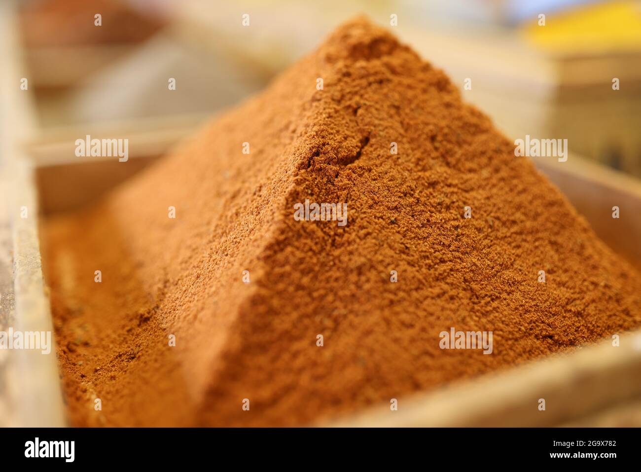 Spicy red-colored seasoning in shape of triangle Stock Photo - Alamy