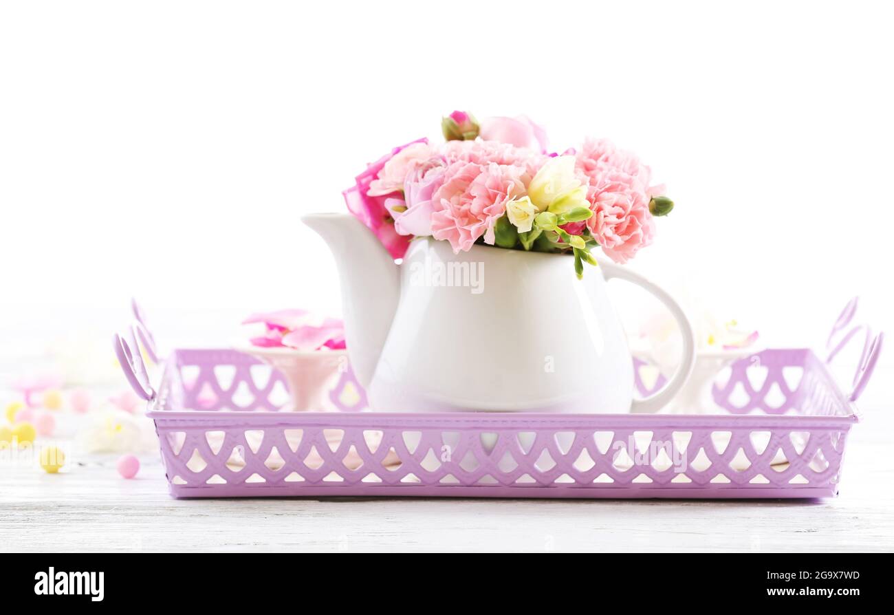 Beautiful spring flowers in teapot isolated on white Stock Photo - Alamy