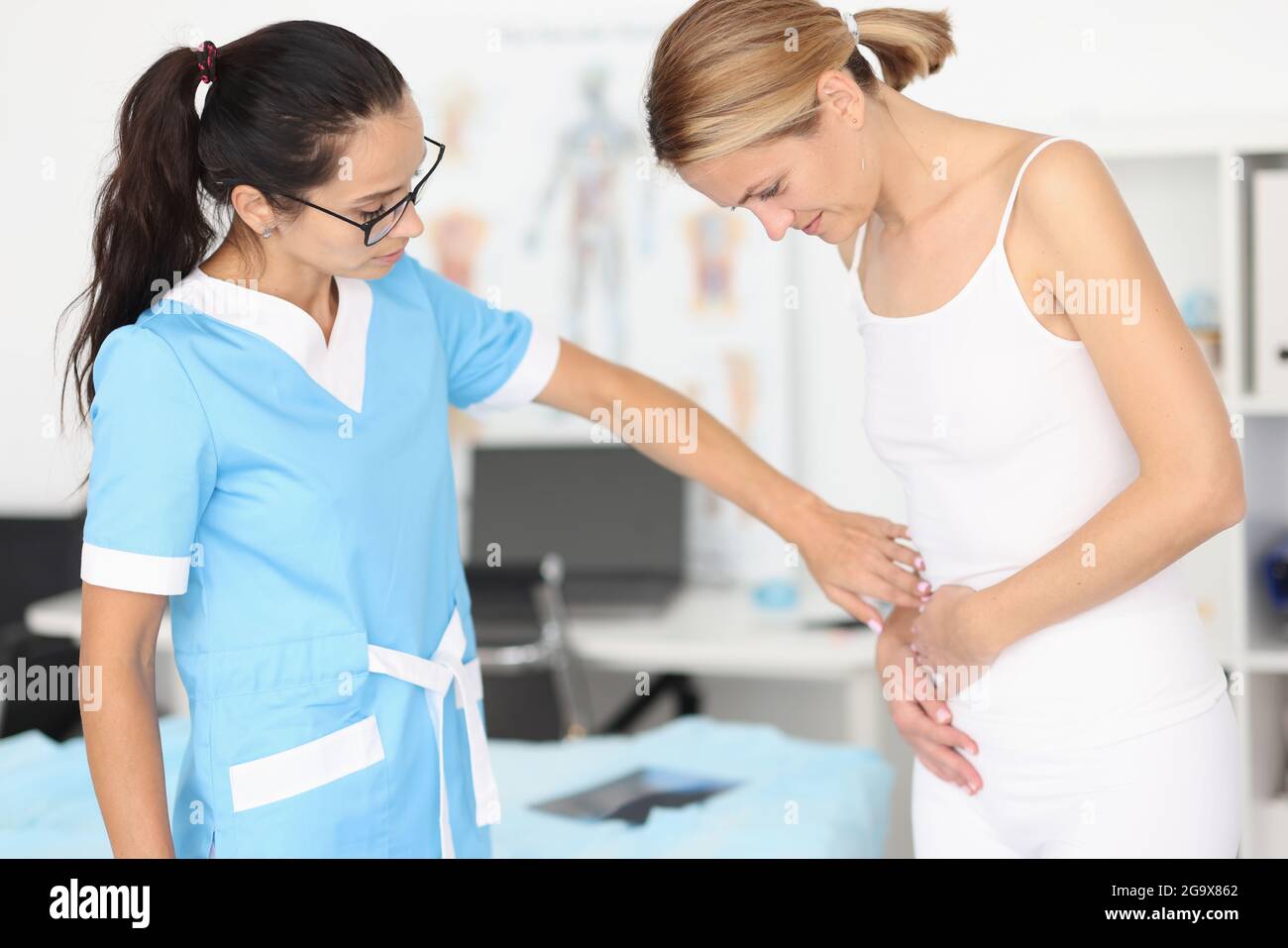 Woman doctor stomach ache hi-res stock photography and images - Alamy