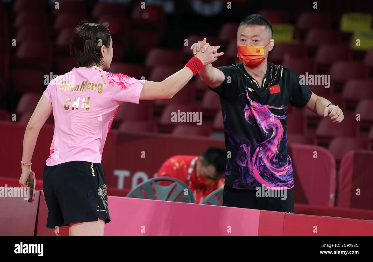 Tokyo, Japan. 28th July, 2021. Coach Ma Lin (R) reacts with Chen Meng ...