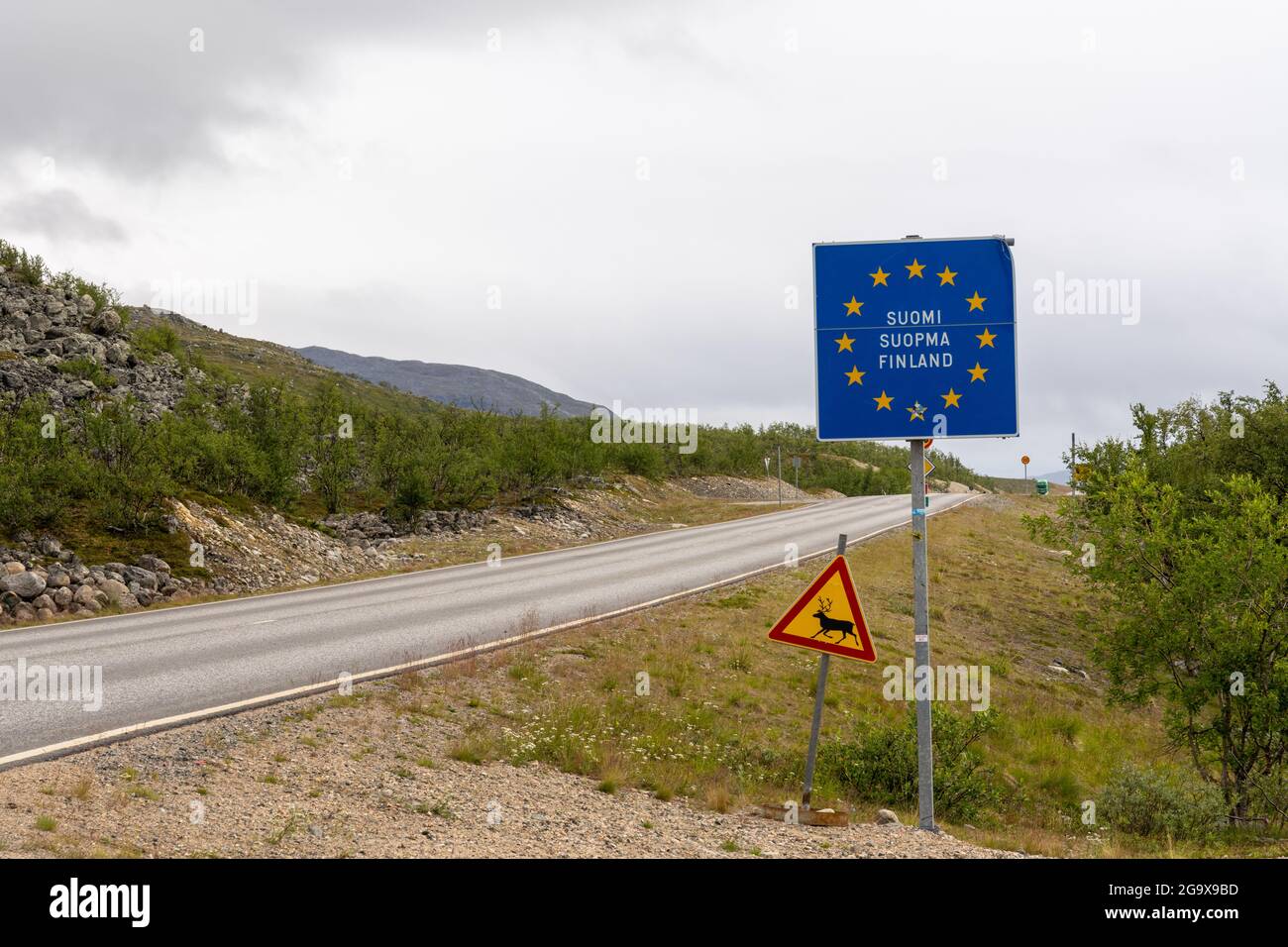 A border sign and reindeer crossing sign at the Finnish border in ...