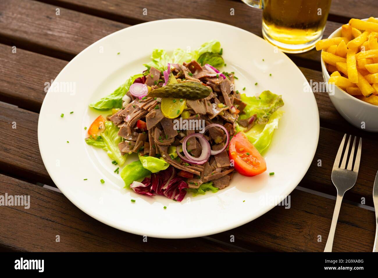 Vegetable salad with boiled beef and gherkins Stock Photo - Alamy