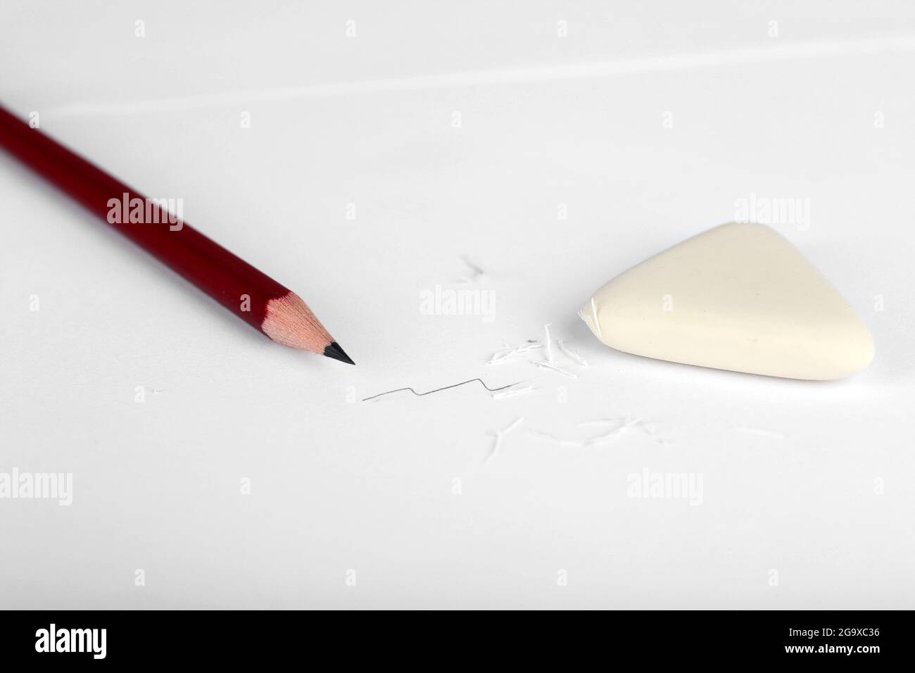 Eraser and pencil on paper background Stock Photo - Alamy