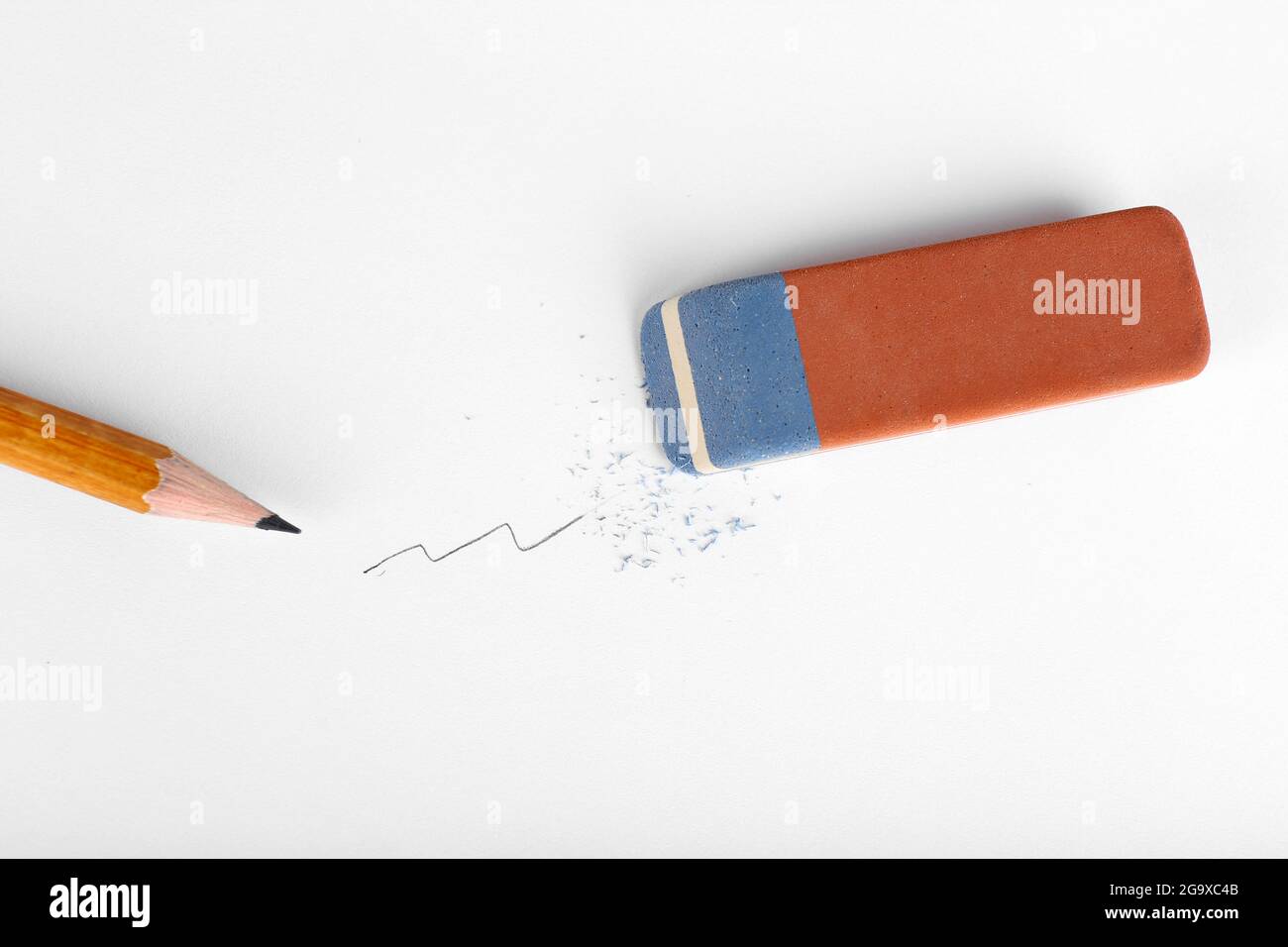 Eraser and pencil on paper background Stock Photo - Alamy