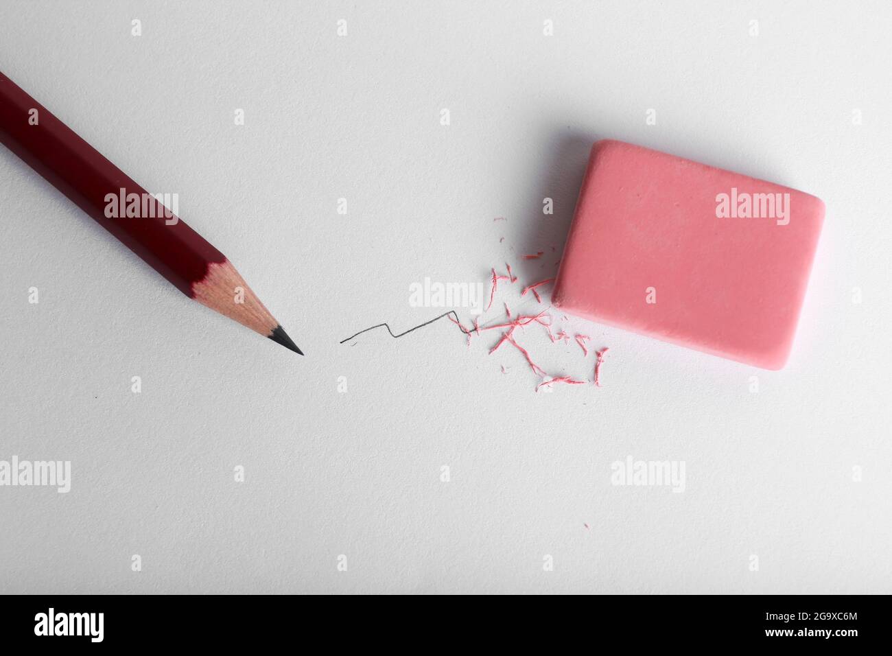 Eraser and pencil on paper background Stock Photo - Alamy