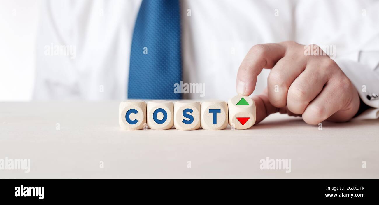 Businessman turning a wooden cube with the arrows symbolizing the ...