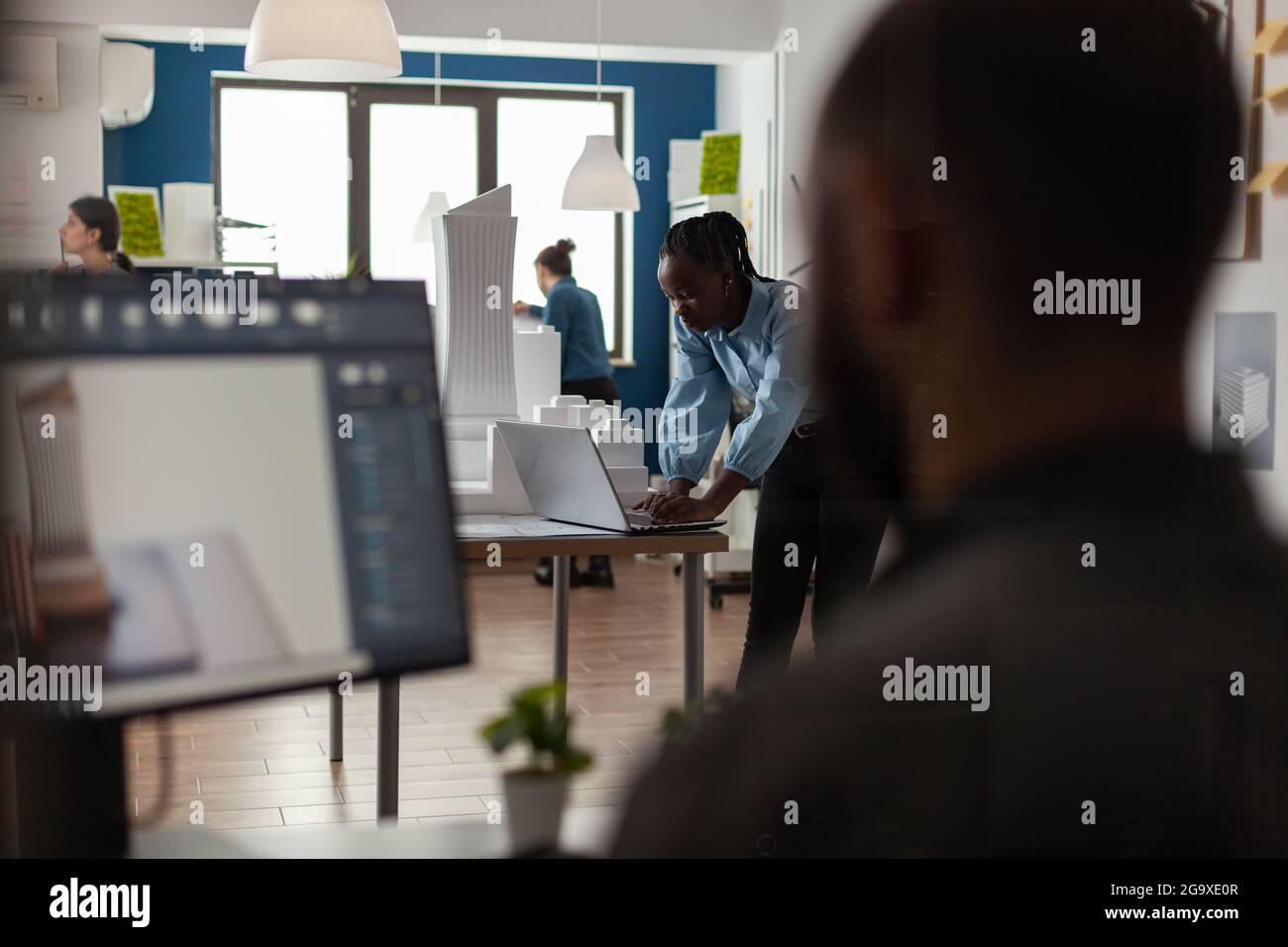 Architecture businesspeople working on computer for building plan ...