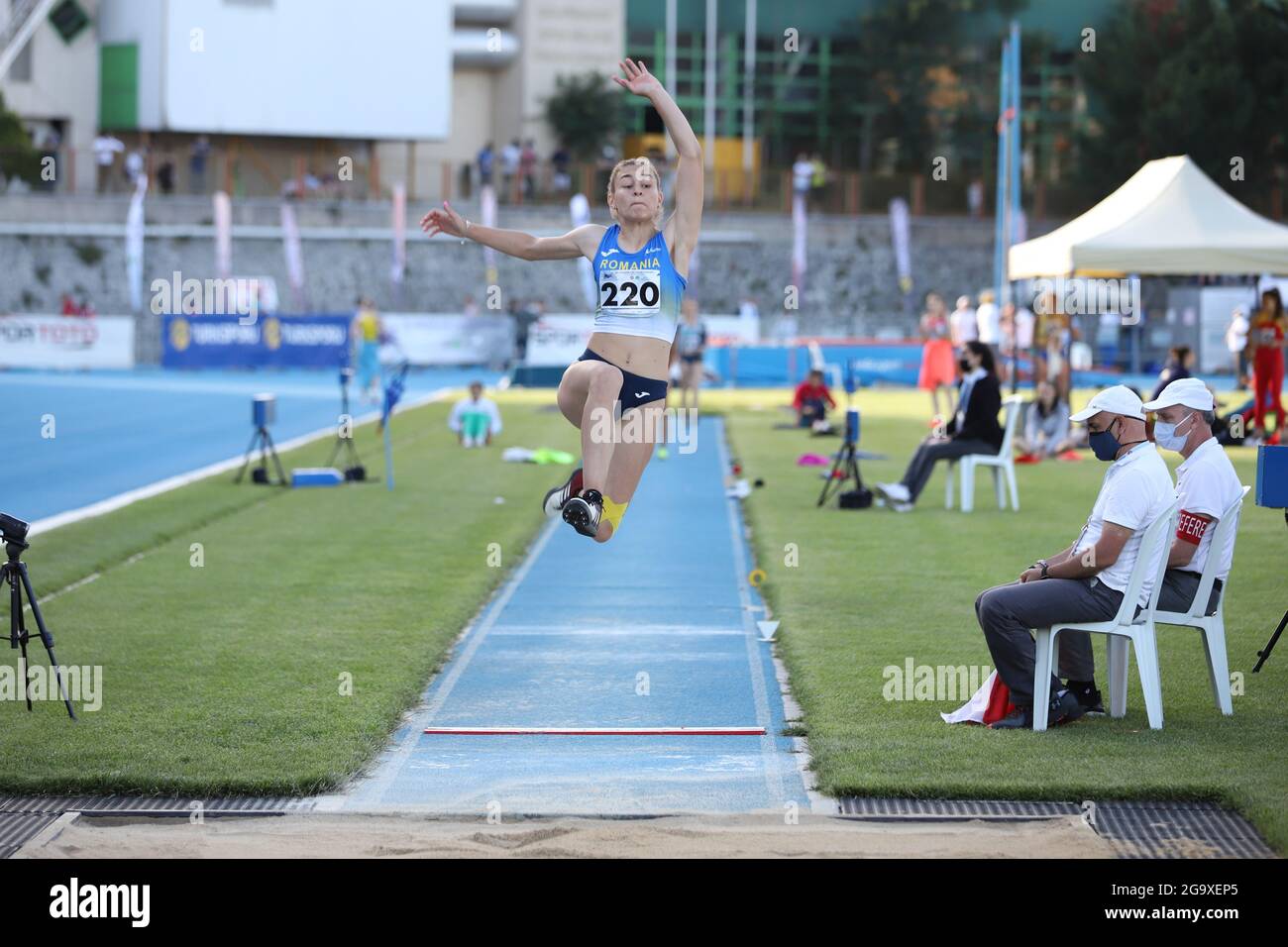 ISTANBUL, TURKEY - JUNE 13, 2021: Undefined athlete long jumping during ...