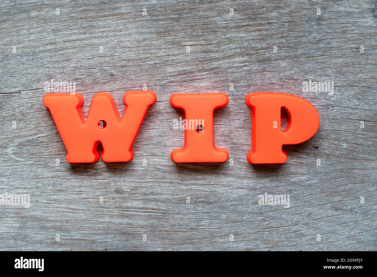 Colorful plastic alphabet in word WIP (Abbreviation of work in progress ...