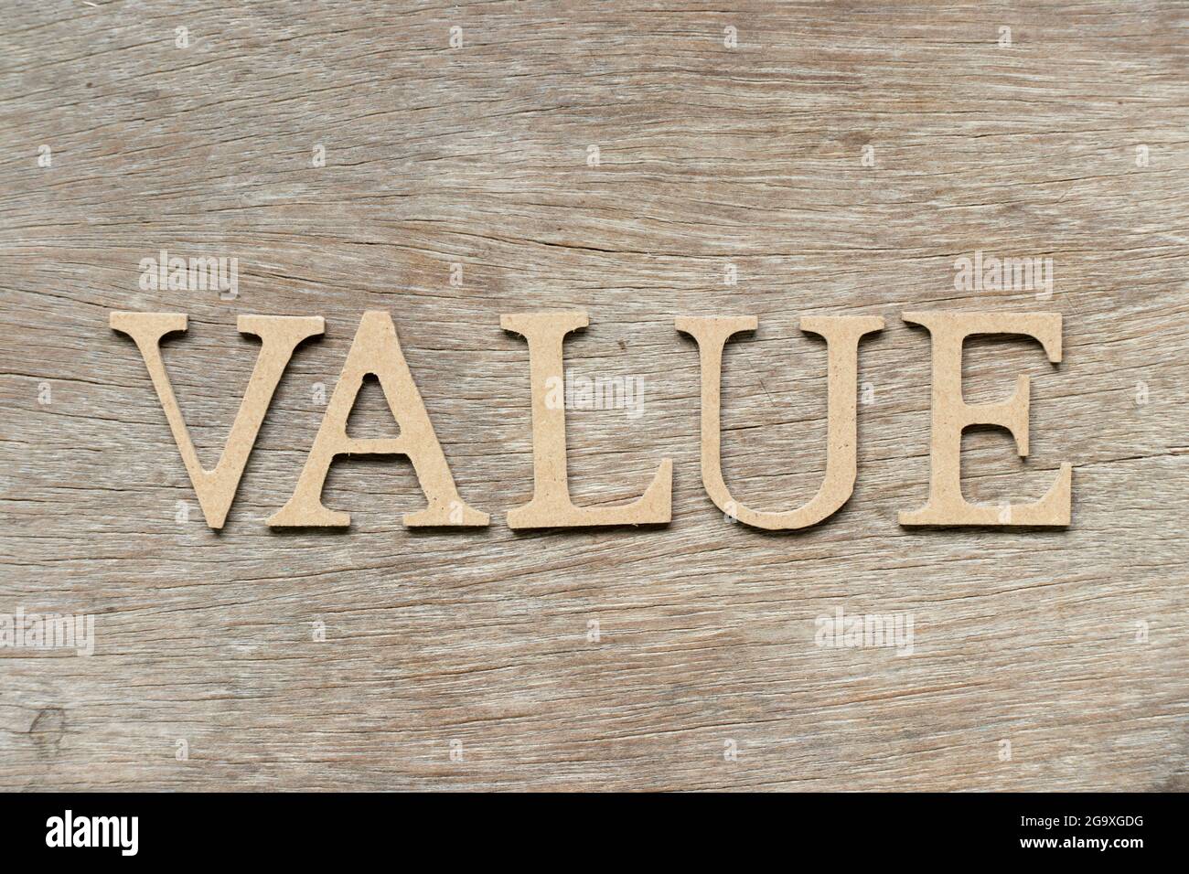Alphabet letter in word value on wood background Stock Photo - Alamy