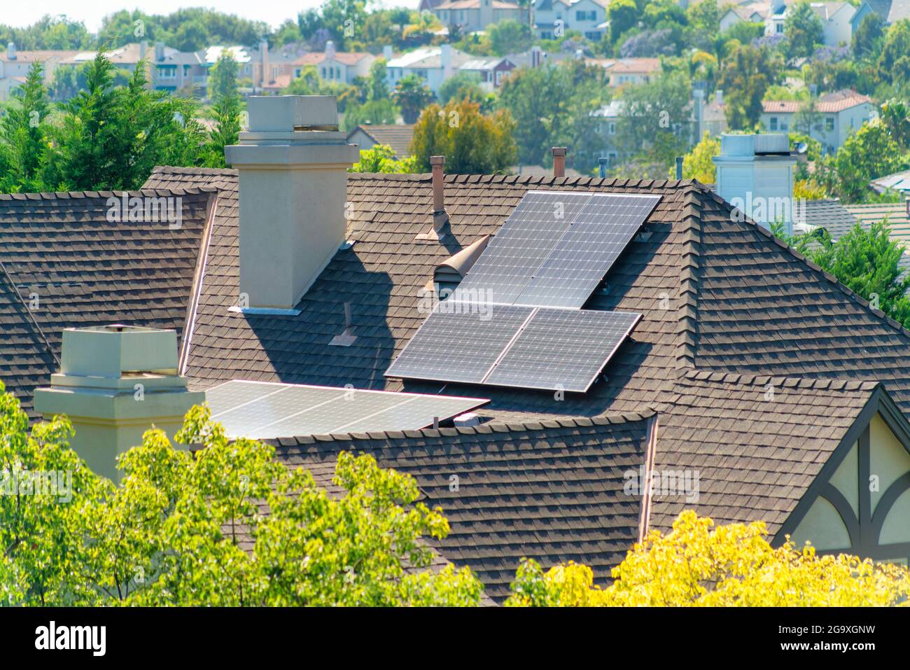 Aerial view of solar panels on a brown tile roof of a medieval-style ...