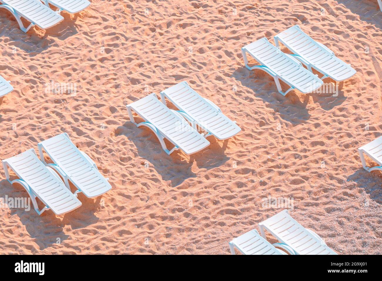 Aerial view of empty sunbeds on the beach. Tourism background photo ...